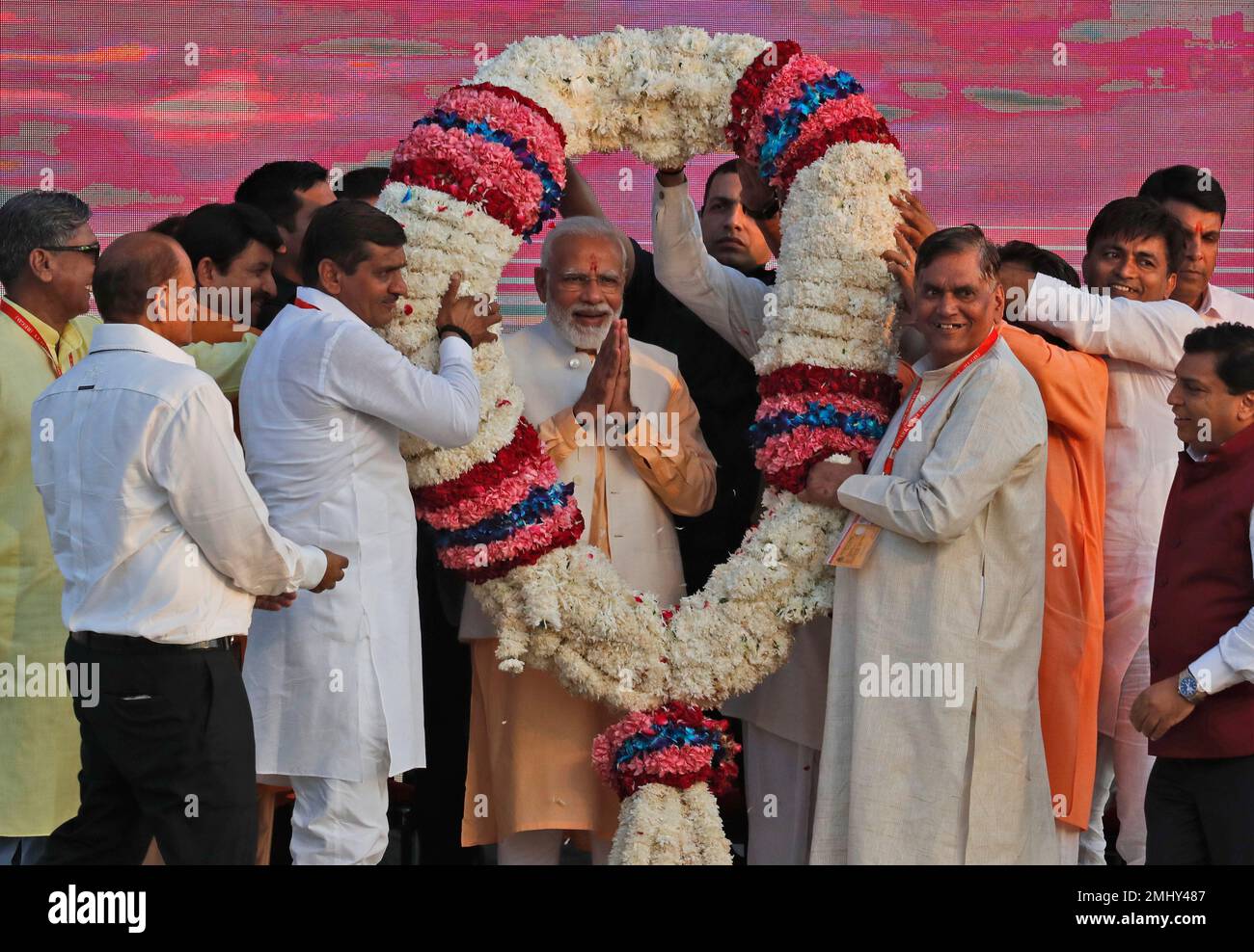 Indian Prime Minister Narendra Modi is presented with a huge floral ...