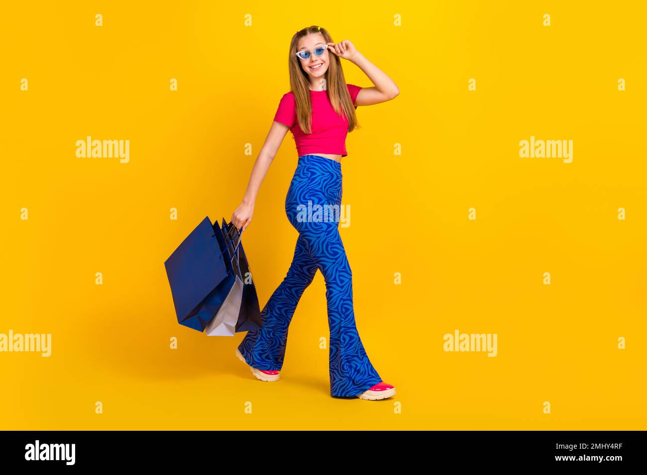 Full length photo of lovely cool lady wear trendy clothes walk empty ...