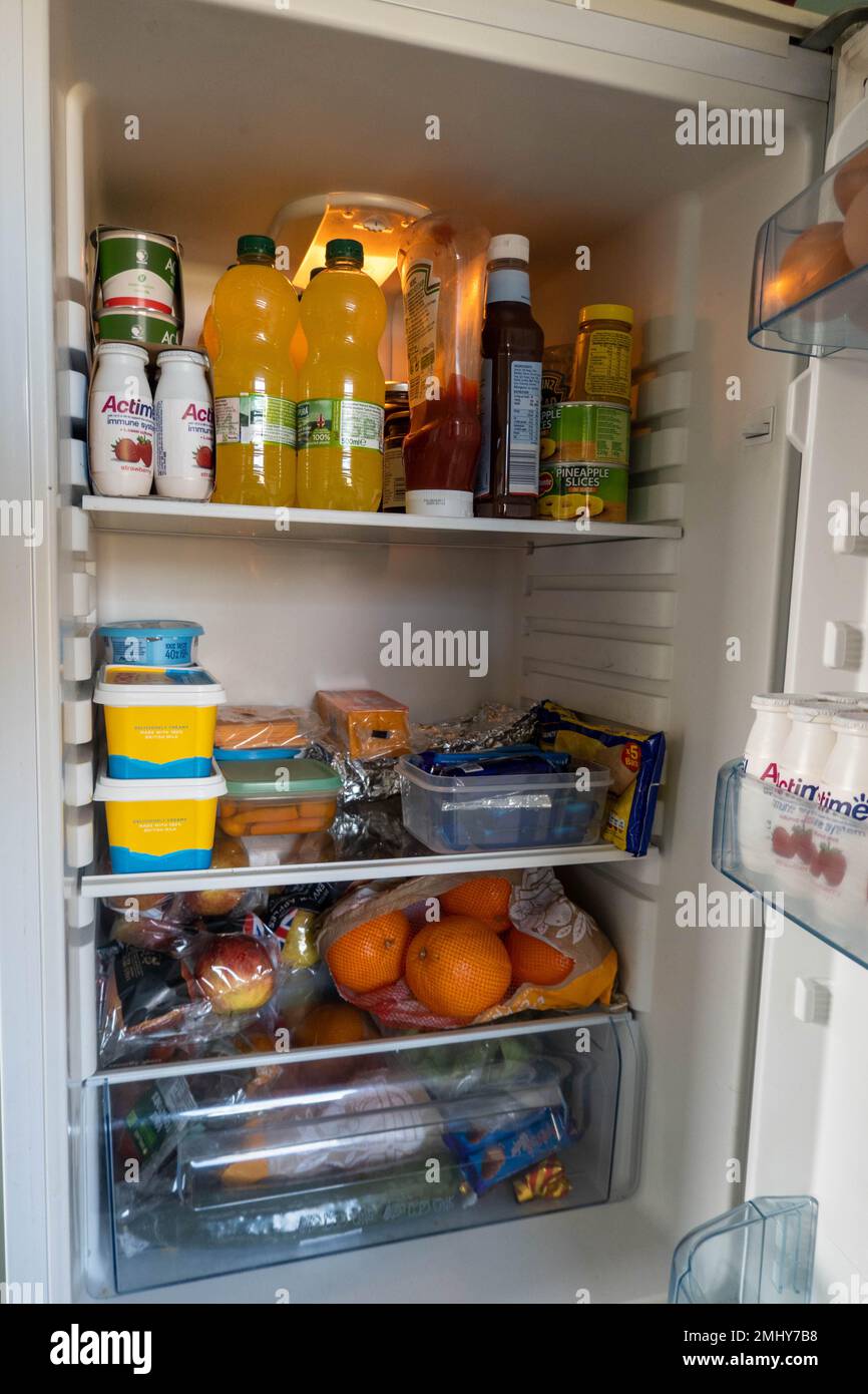 Inside view of a fridge with various food and drinks on view Stock ...