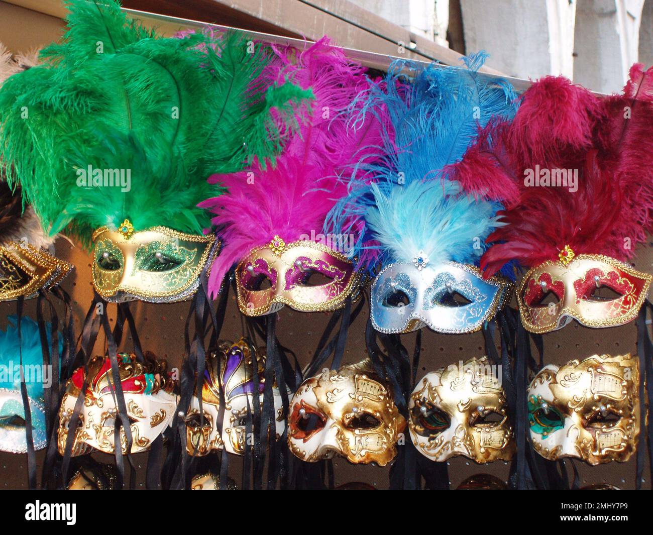 beautiful intensely colored masks displayed on a stall for the venice ...
