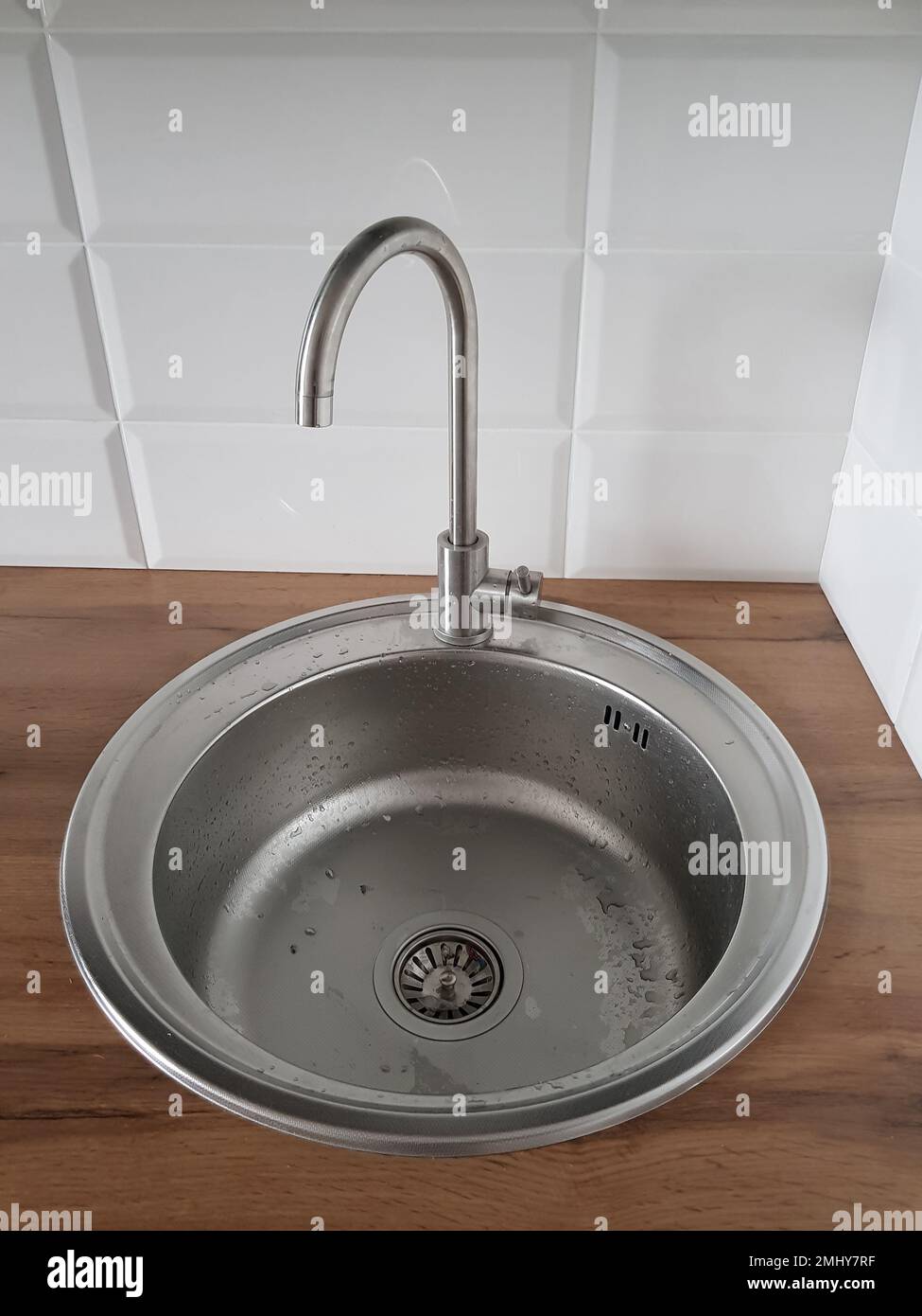 Modern kitchen interior. New modern faucet and kitchen room sink ...