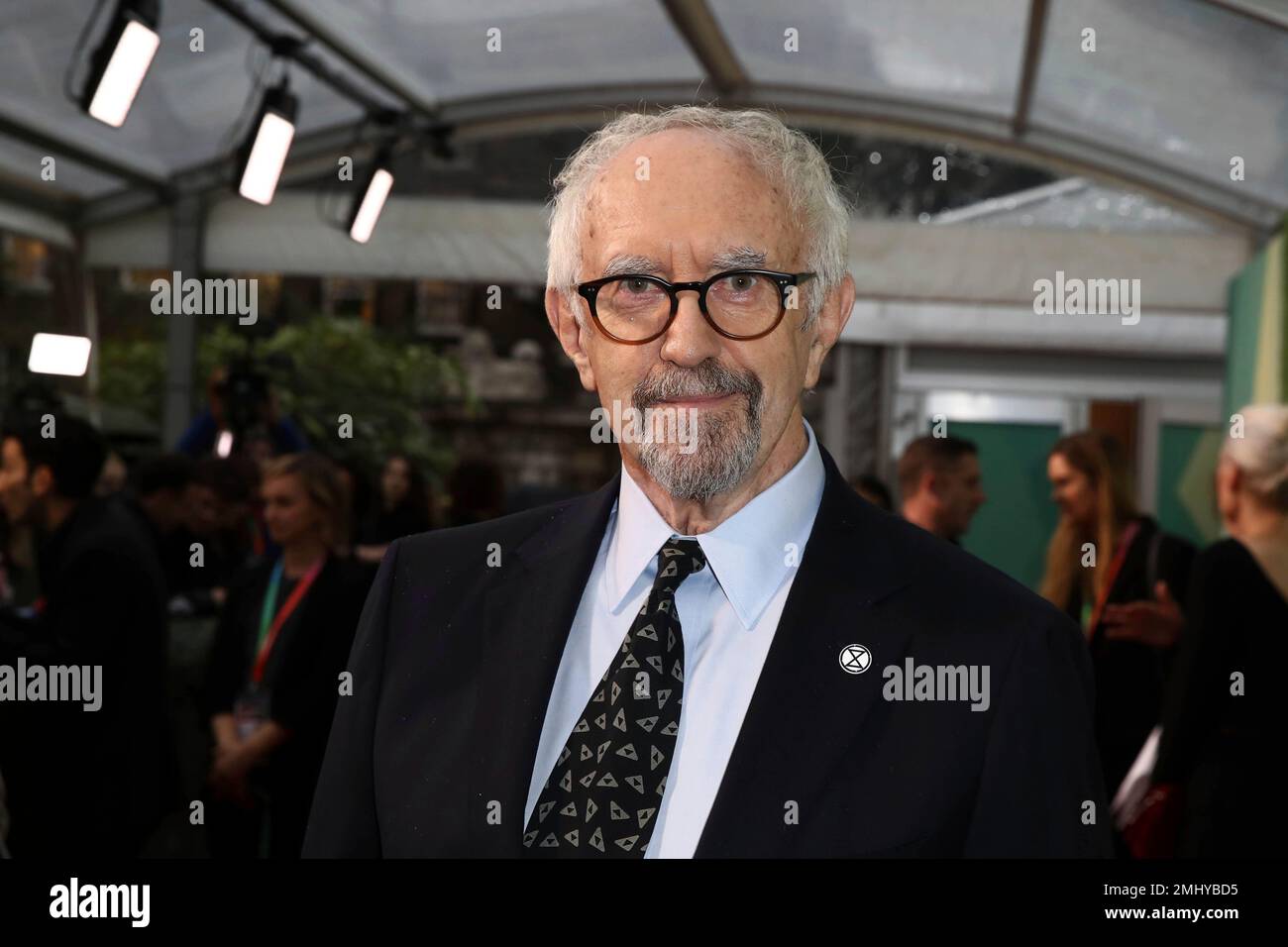 Actor Jonathan Pryce poses for photographers upon arrival at the ...