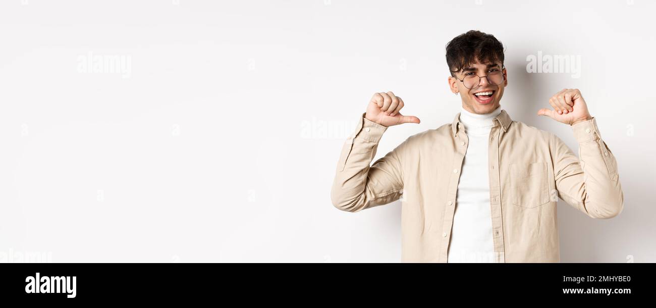 Image of motivated smiling handsome man pointing at himself, self ...