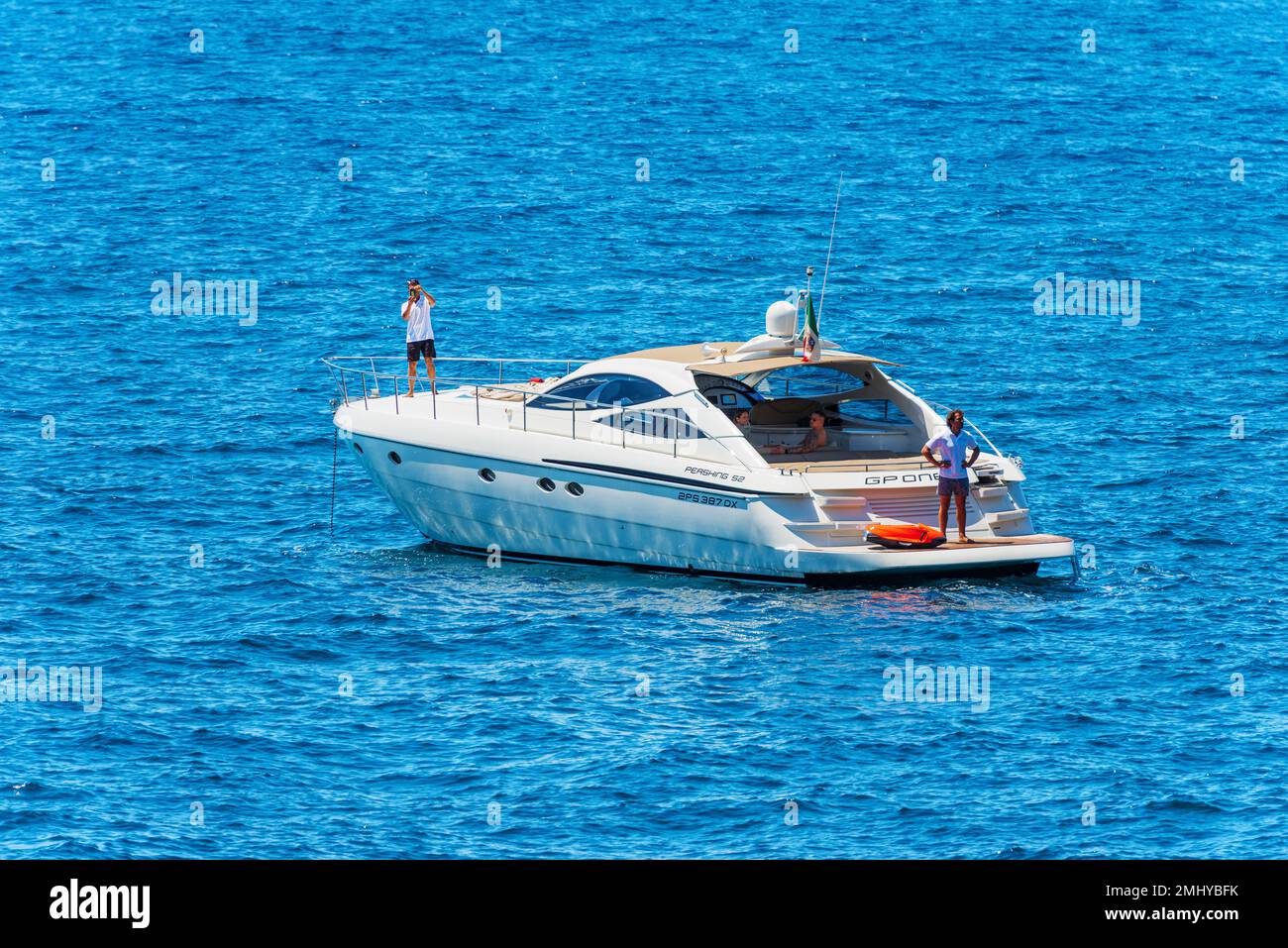 Luxury motor boat anchored in the blue Mediterranean sea with some ...