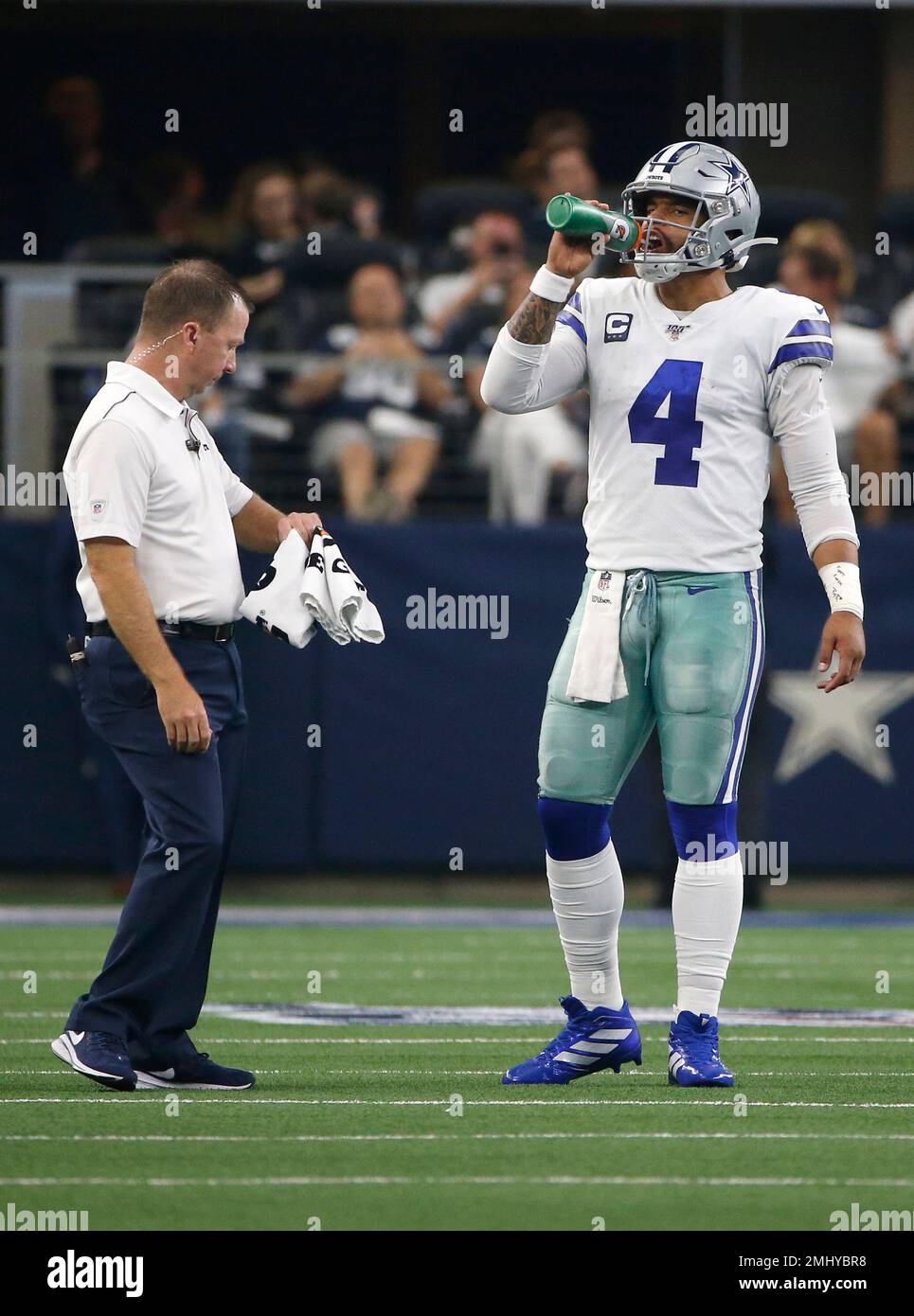 Dallas Cowboys quarterback Dak Prescott (4) takes a break between plays ...