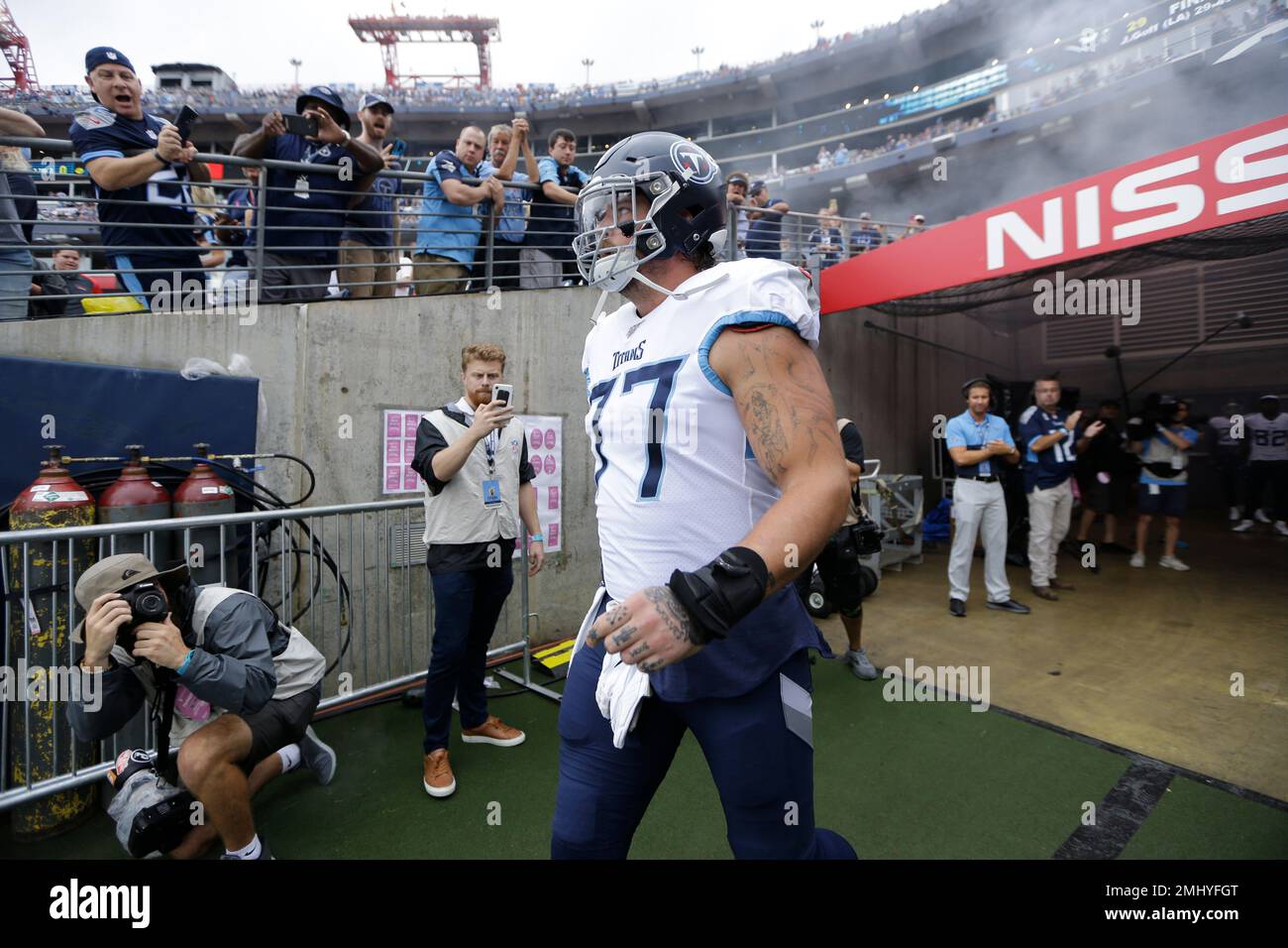 Tennessee Titans offensive tackle Taylor Lewan takes the field before ...