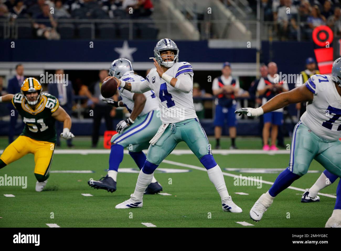Dallas Cowboys' Dak Prescott (4) throws a pass under pressure from ...