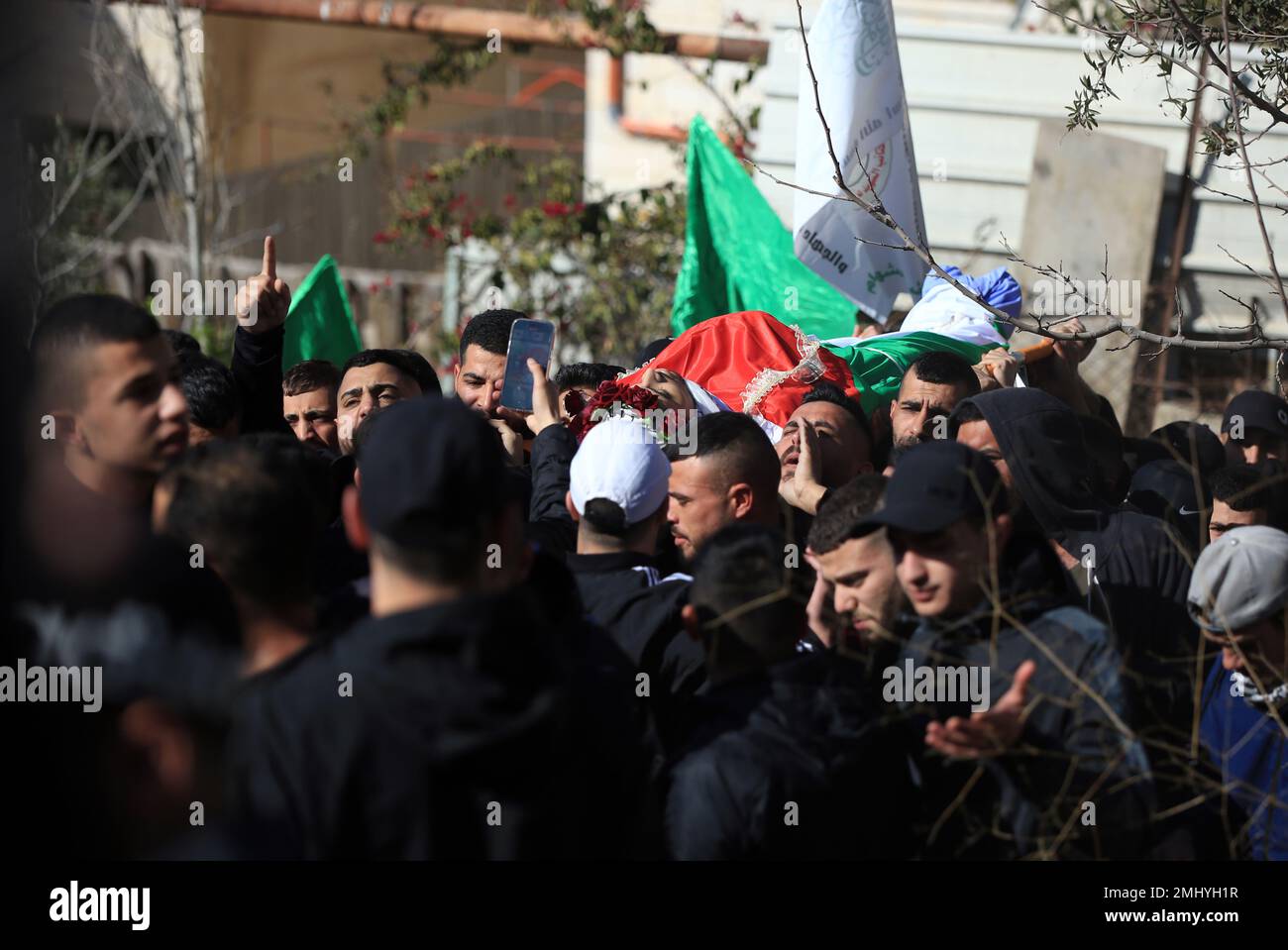 (EDITORS NOTE: Image depicts death)Mourners carry the body of ...