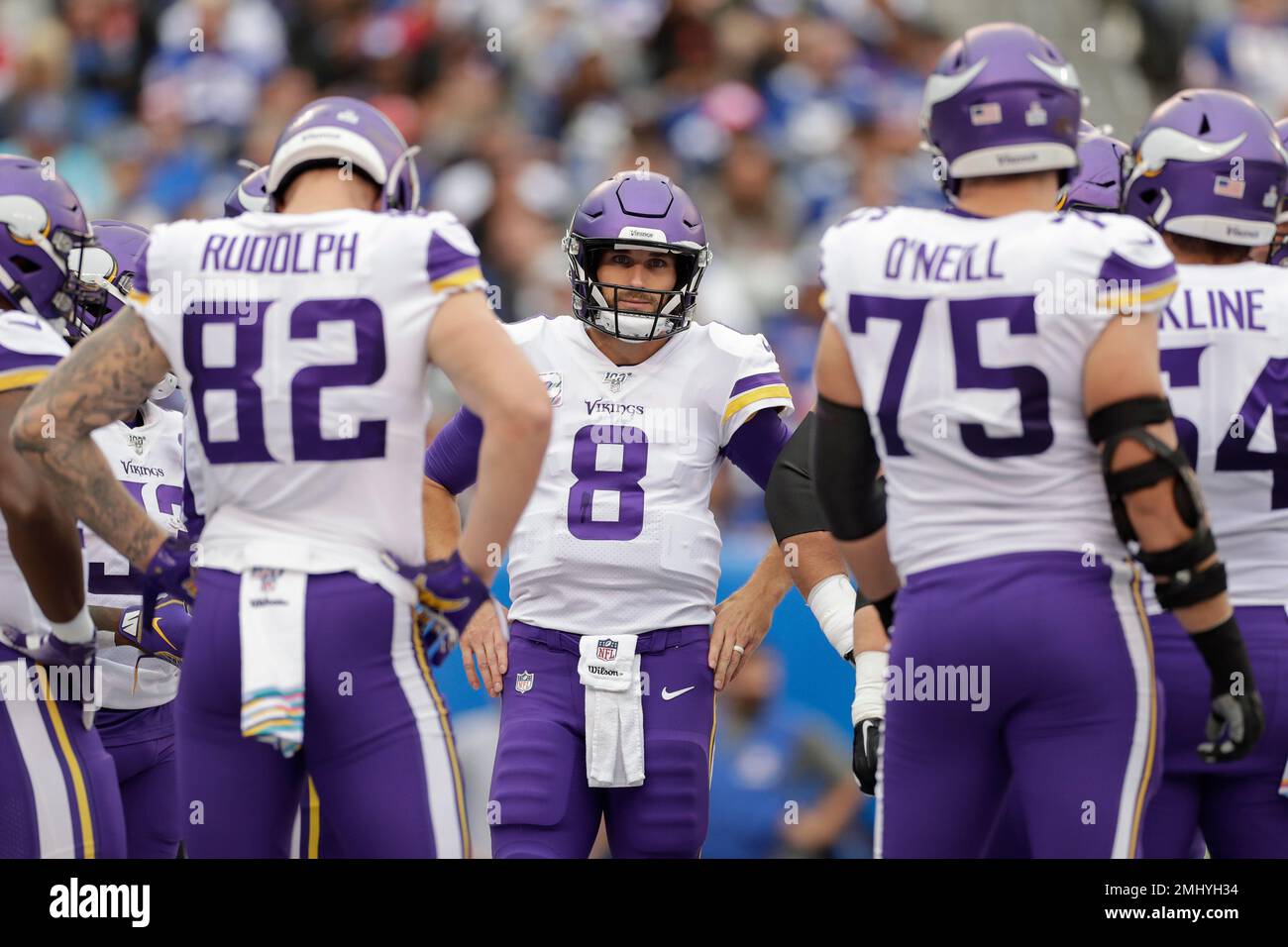 Minnesota Vikings quarterback Kirk Cousins (8) huddles with teammates ...