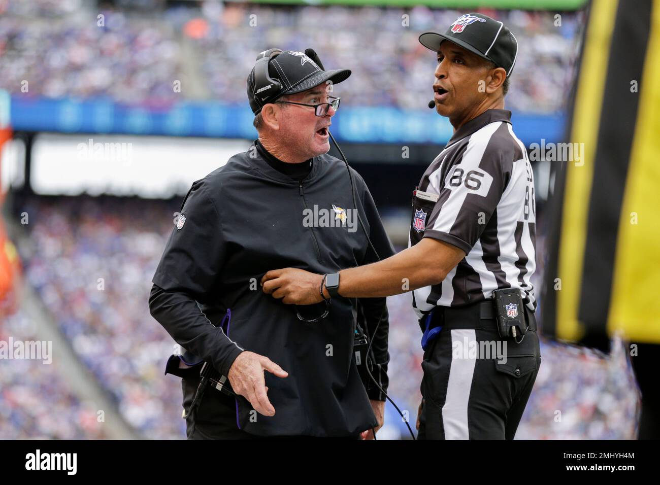 Minnesota Vikings head coach Mike Zimmer talks with field judge Jimmy ...