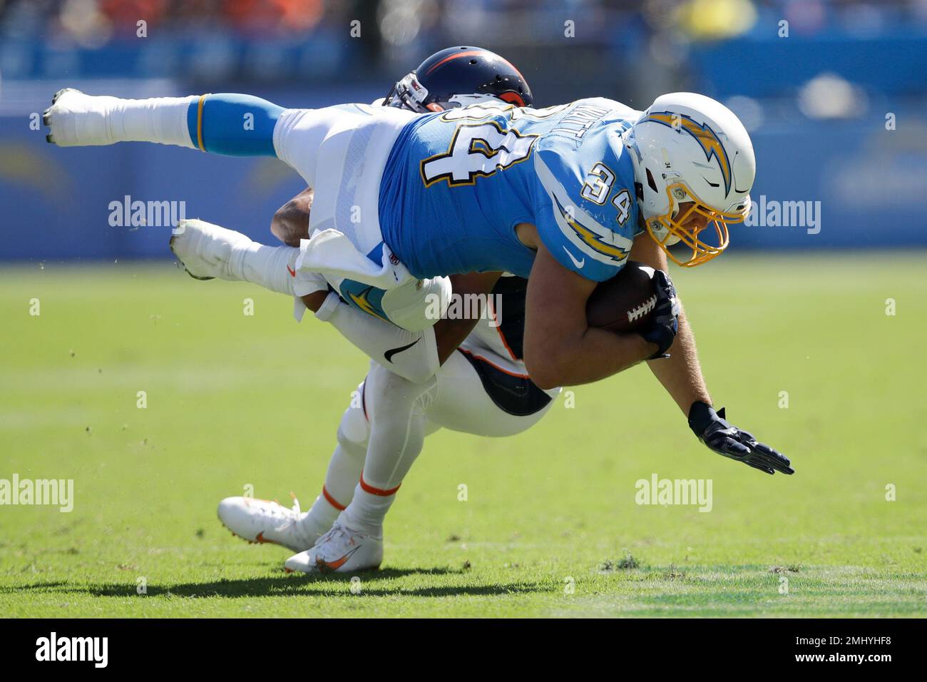 Los Angeles Chargers fullback Derek Watt is tackled by Denver Broncos ...