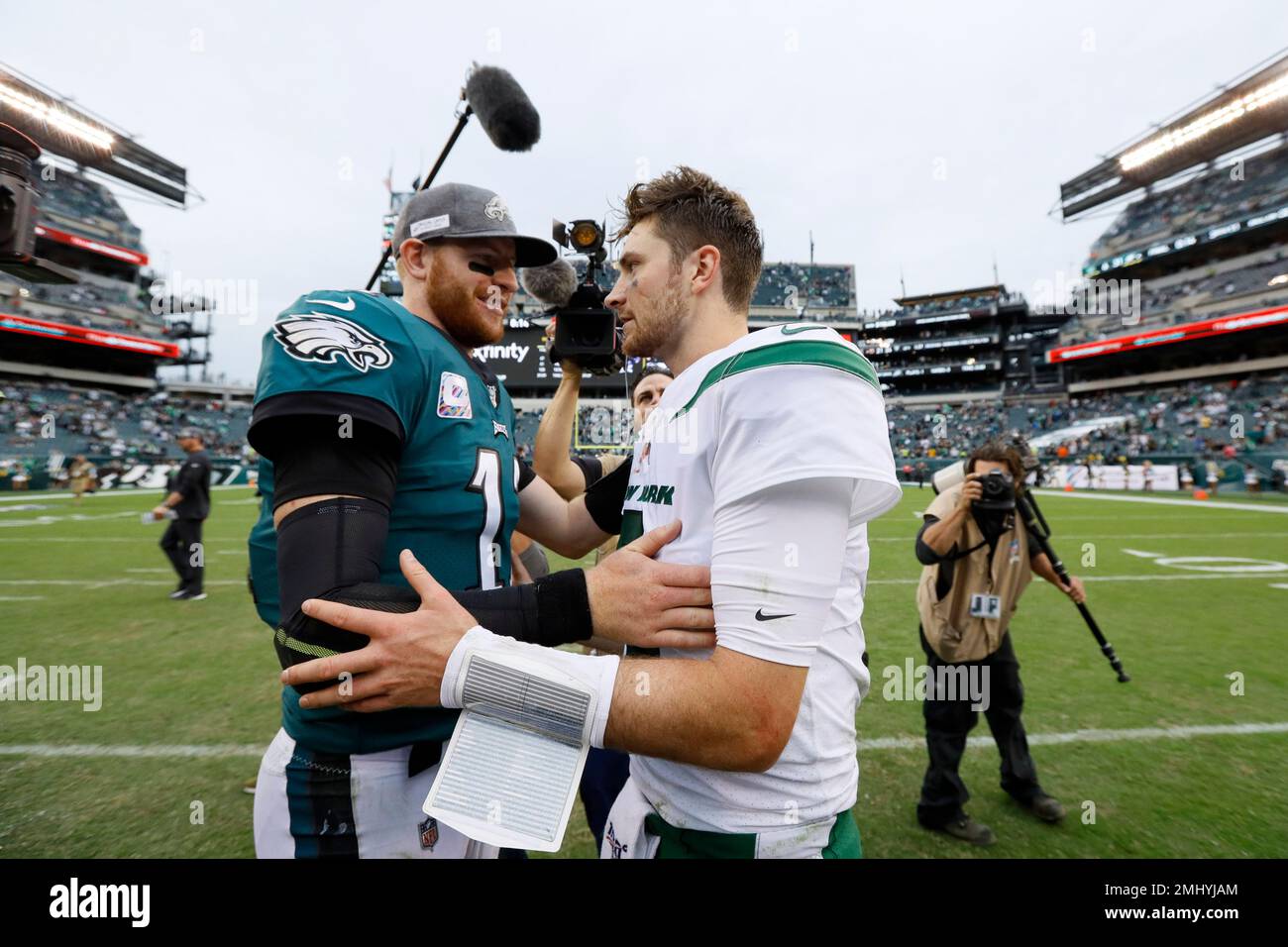 Philadelphia Eagles' Carson Wentz, left, and New York Jets' Luke Falk meet after an NFL football ...