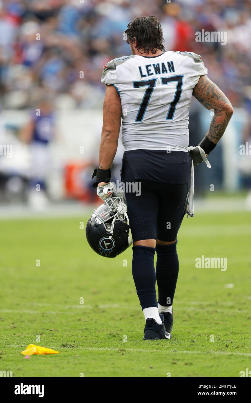 Tennessee Titans offensive tackle Taylor Lewan walks away after a ...