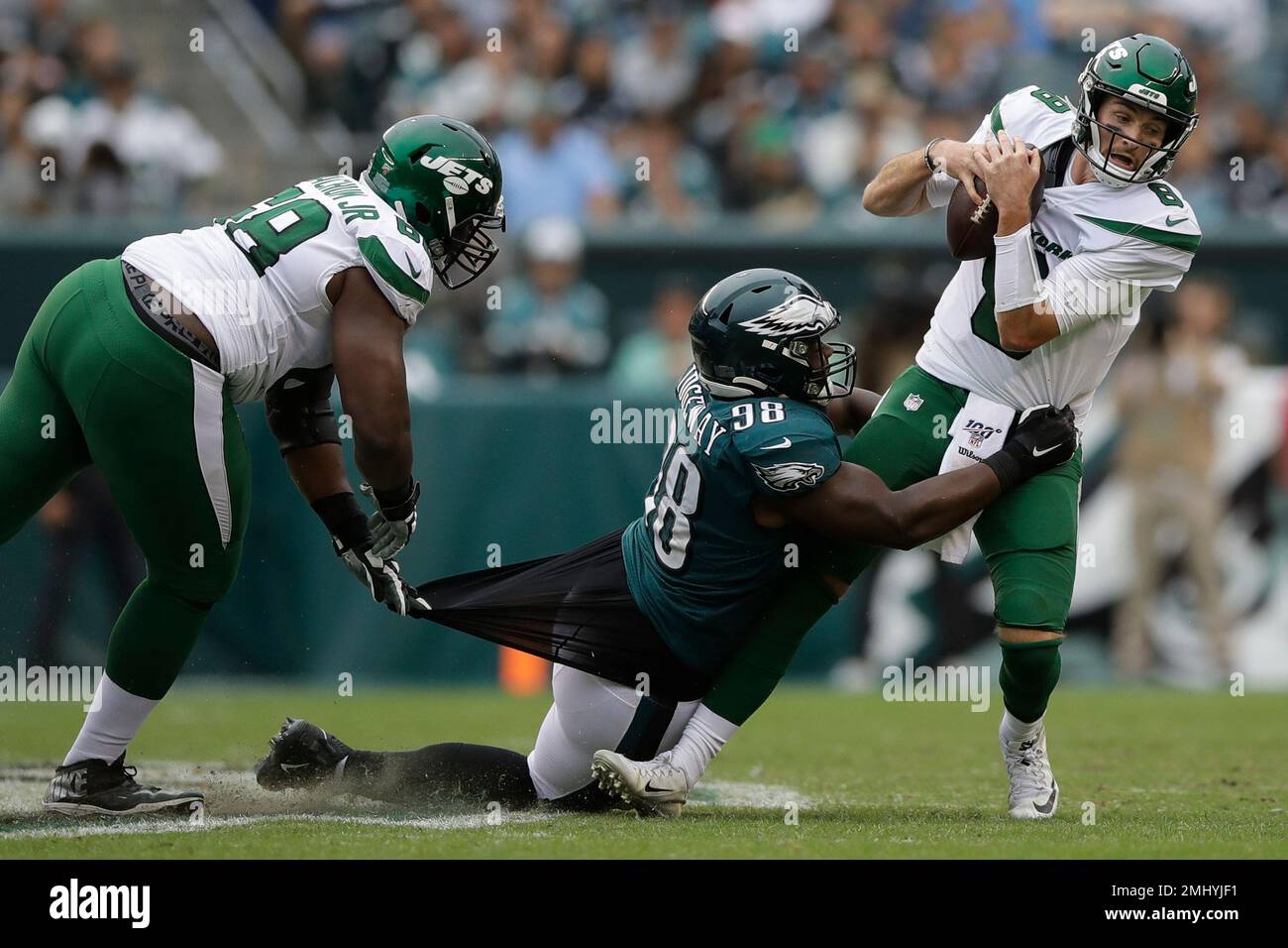 Philadelphia Eagles' Hassan Ridgeway (98) tries to tackle New York Jets' Luke Falk (8) as Kelvin ...