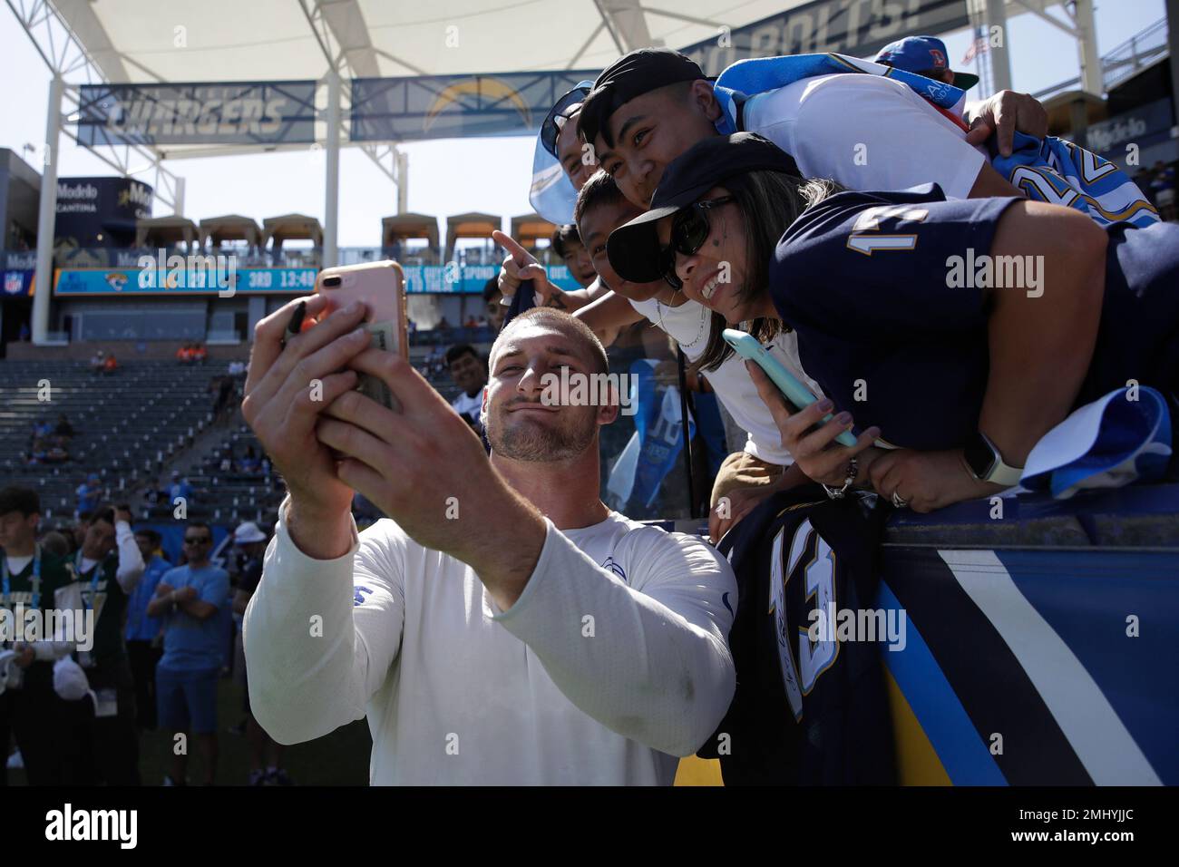Los Angeles Chargers defensive end Joey Bosa poses with fans before an ...
