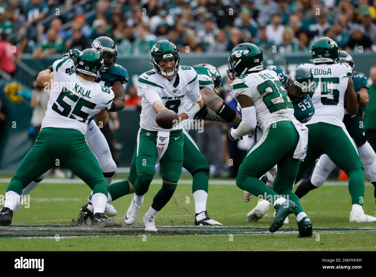 New York Jets' Luke Falk hands off to Le'Veon Bell during the second half of an NFL football ...
