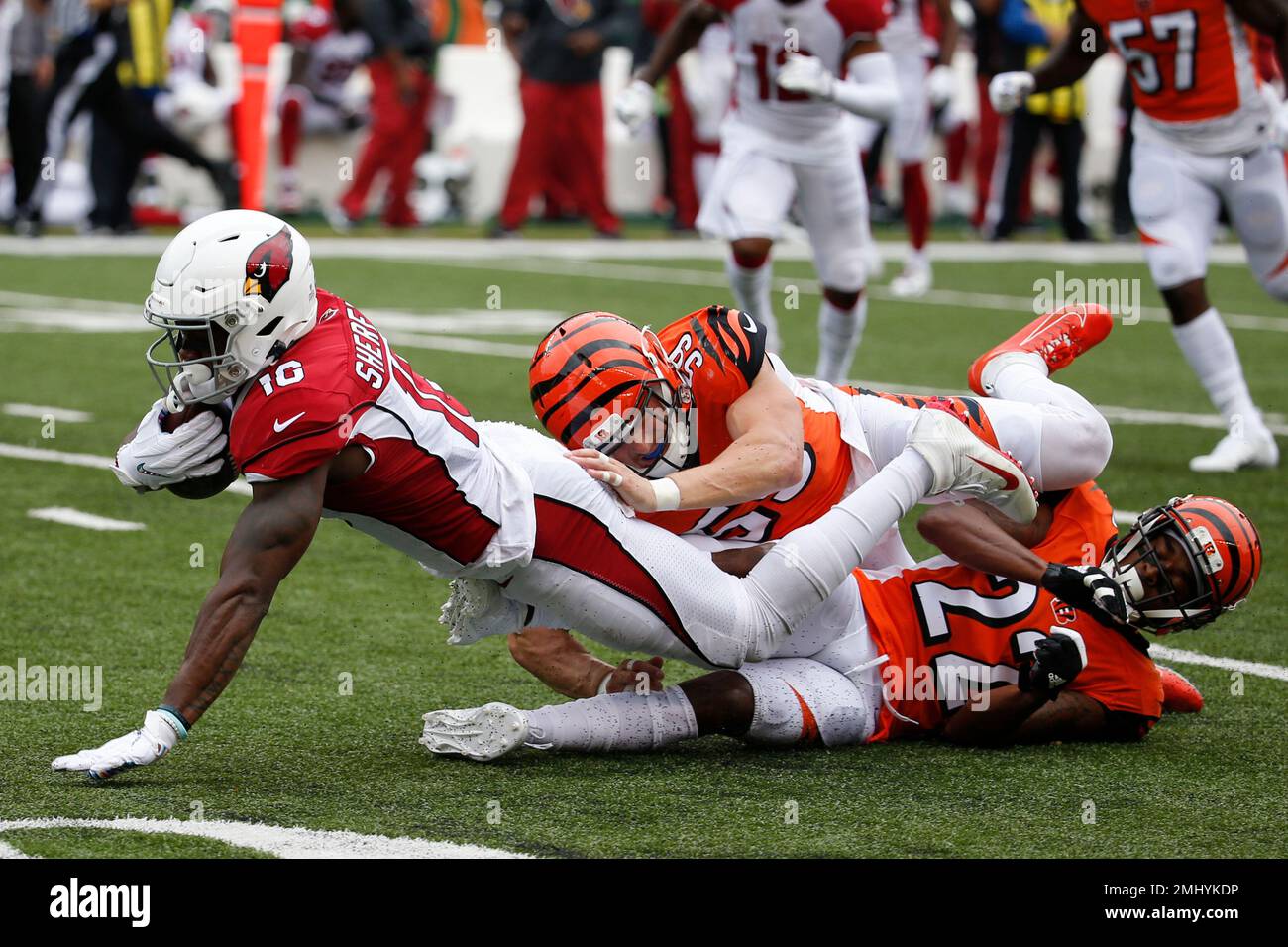 Arizona Cardinals wide receiver Trent Sherfield, left, is tackled by ...
