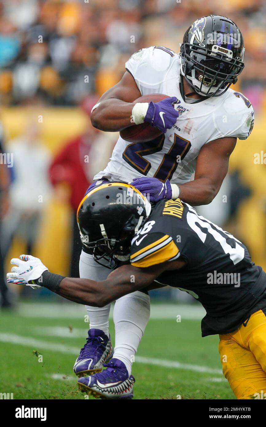 Baltimore Ravens running back Mark Ingram (21) is tackled by Pittsburgh ...