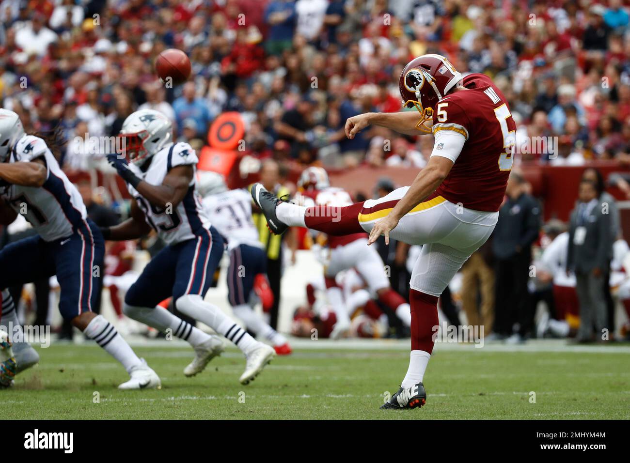 Washington Redskins punter Tress Way (5) works against the New England ...