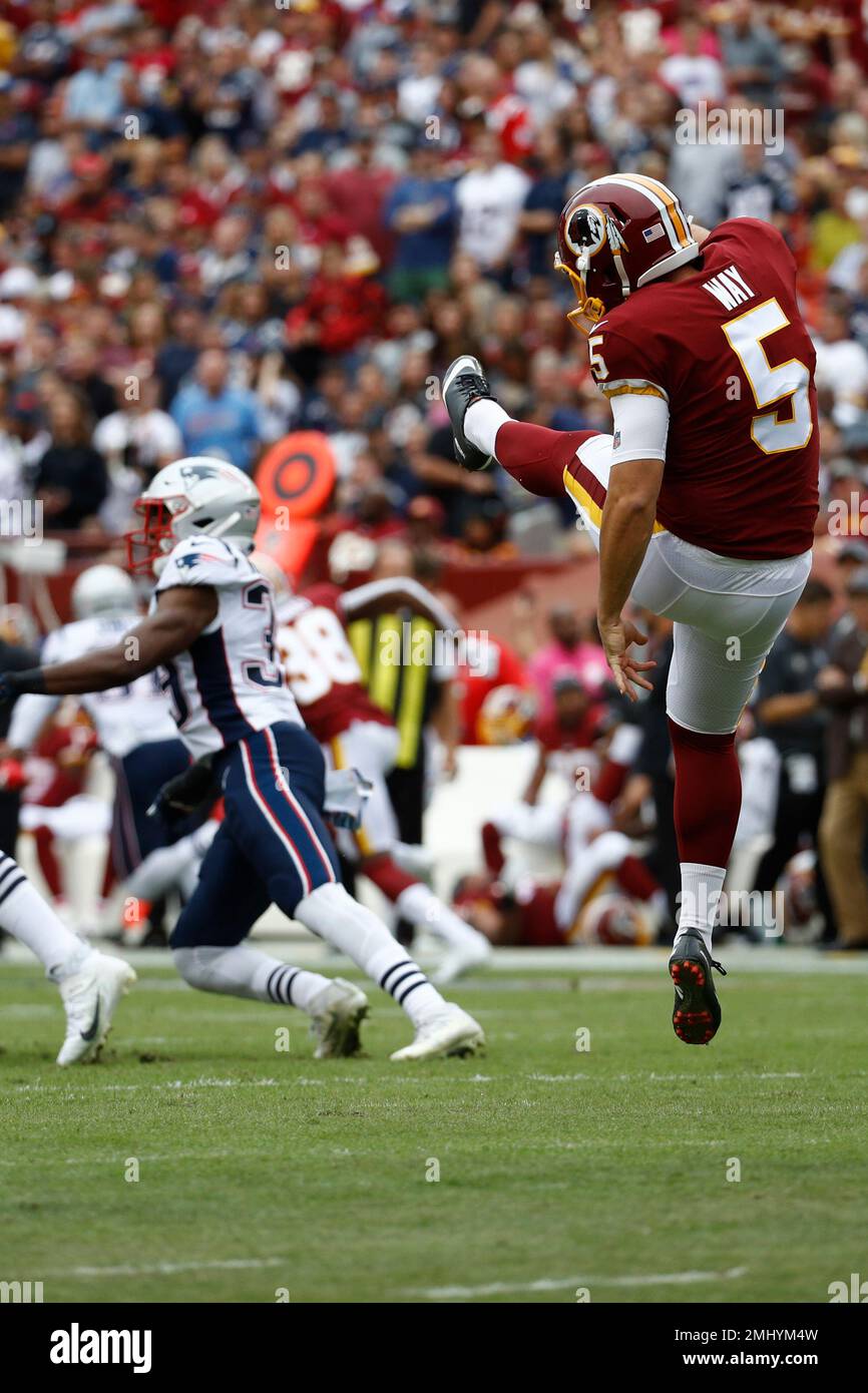Washington Redskins punter Tress Way (5) works against the New England ...