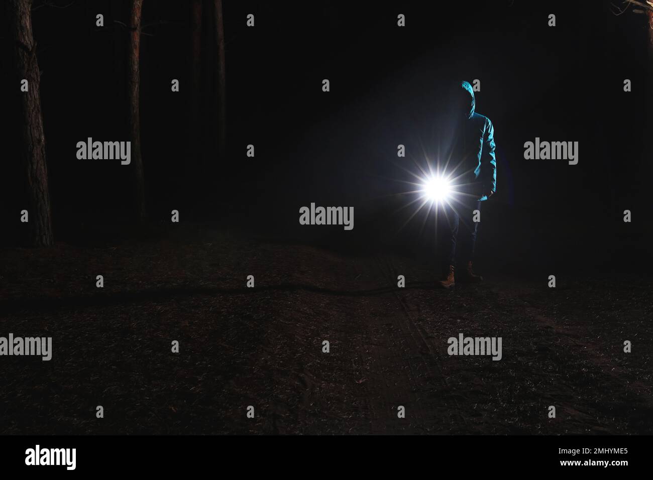 Man flashlight trees hi-res stock photography and images - Alamy