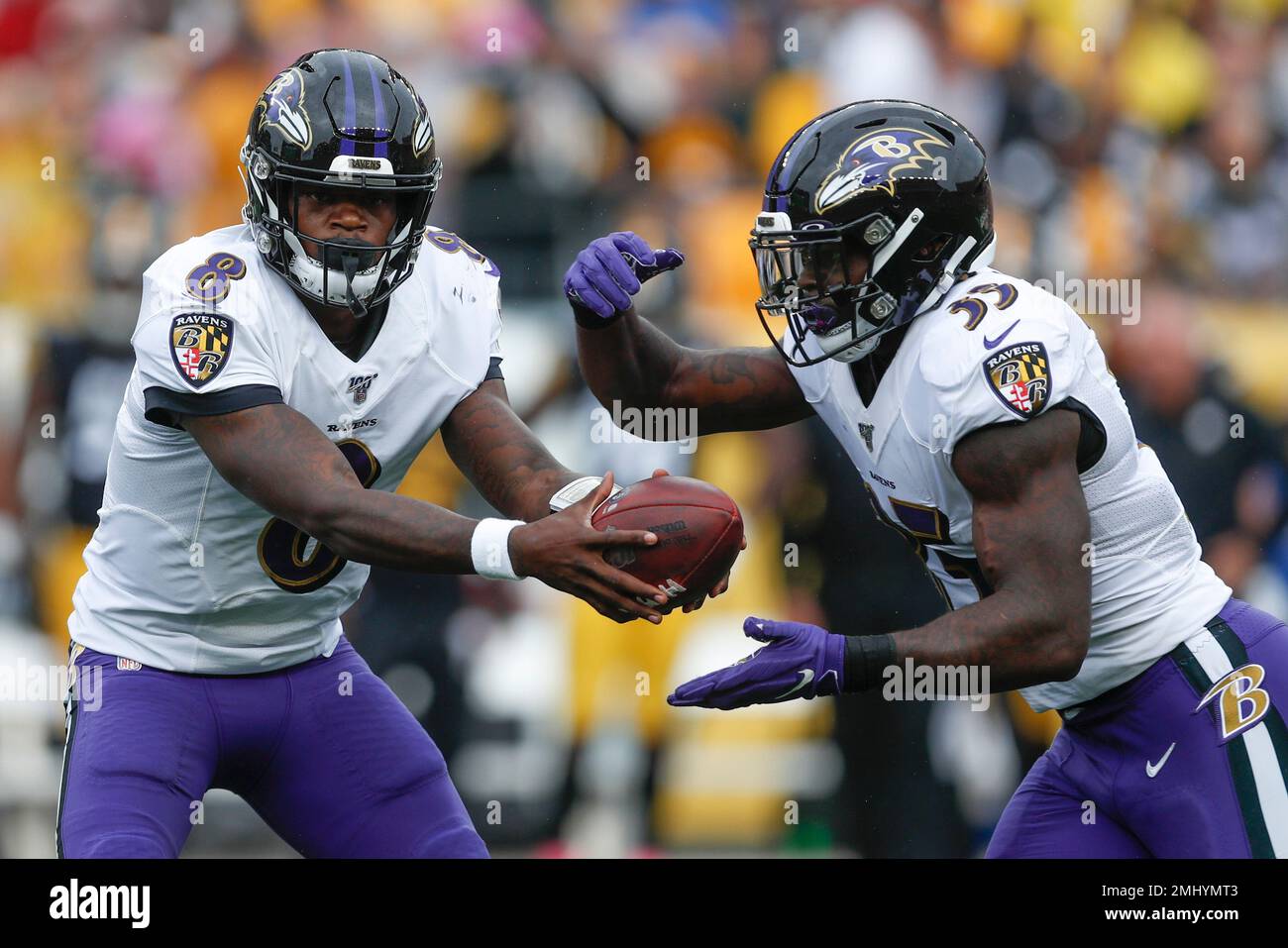 Baltimore Ravens quarterback Lamar Jackson (8) hands off to running ...