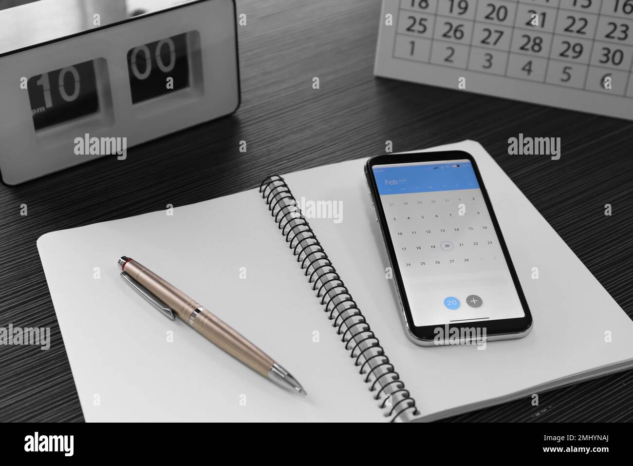 Modern smartphone with calendar on screen in office Stock Photo - Alamy