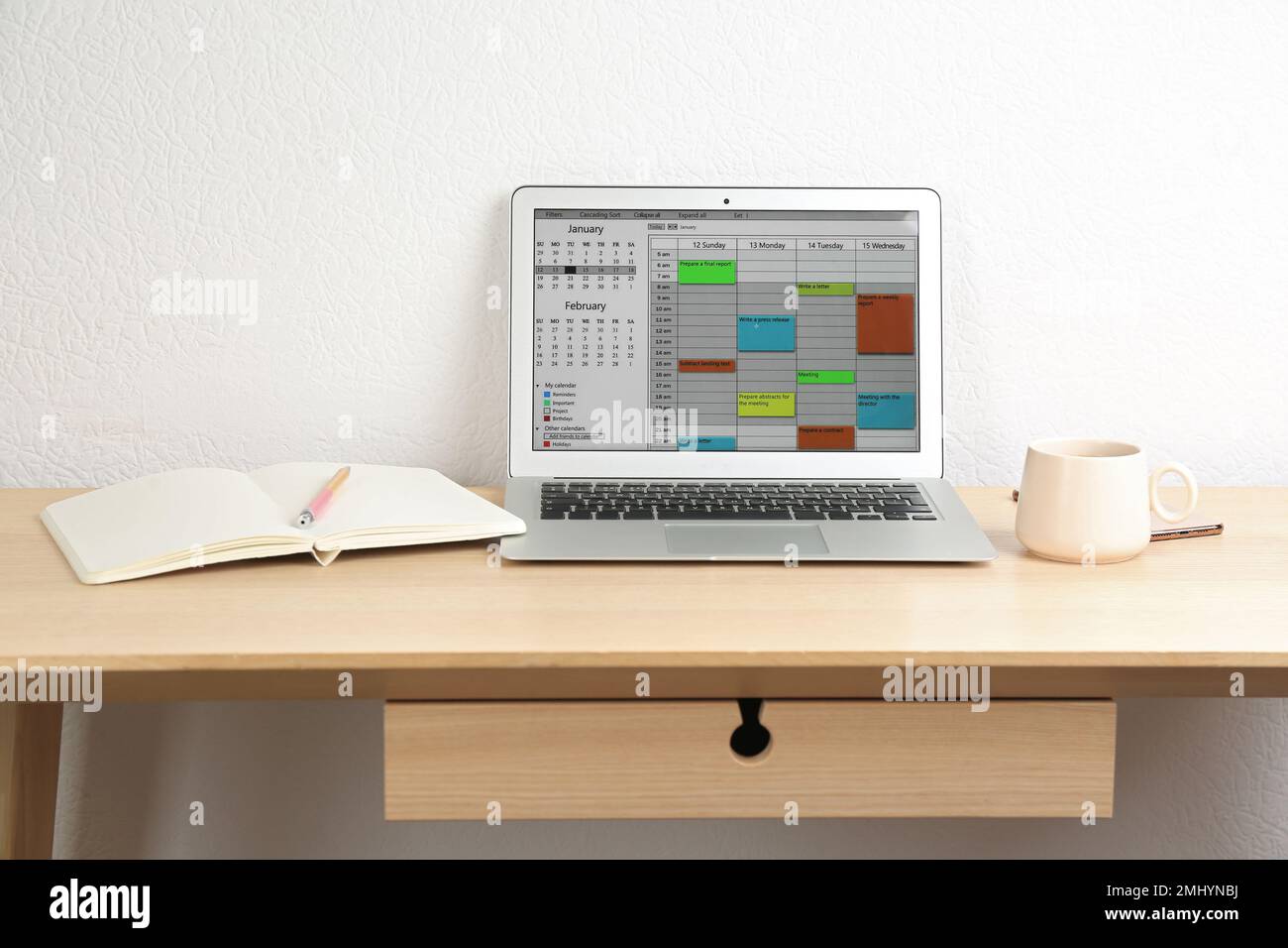 Modern laptop with calendar app in office Stock Photo - Alamy
