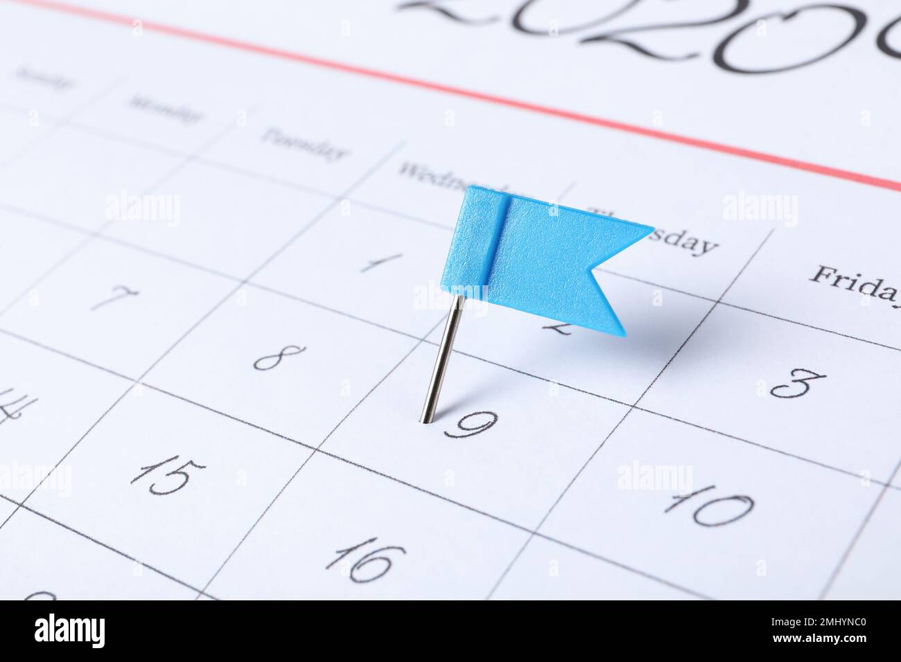 Calendar page marked with drawing pin, closeup Stock Photo - Alamy