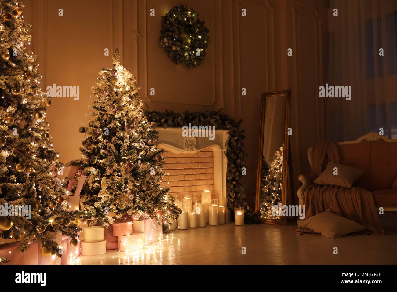Festive room interior with beautiful Christmas trees Stock Photo - Alamy