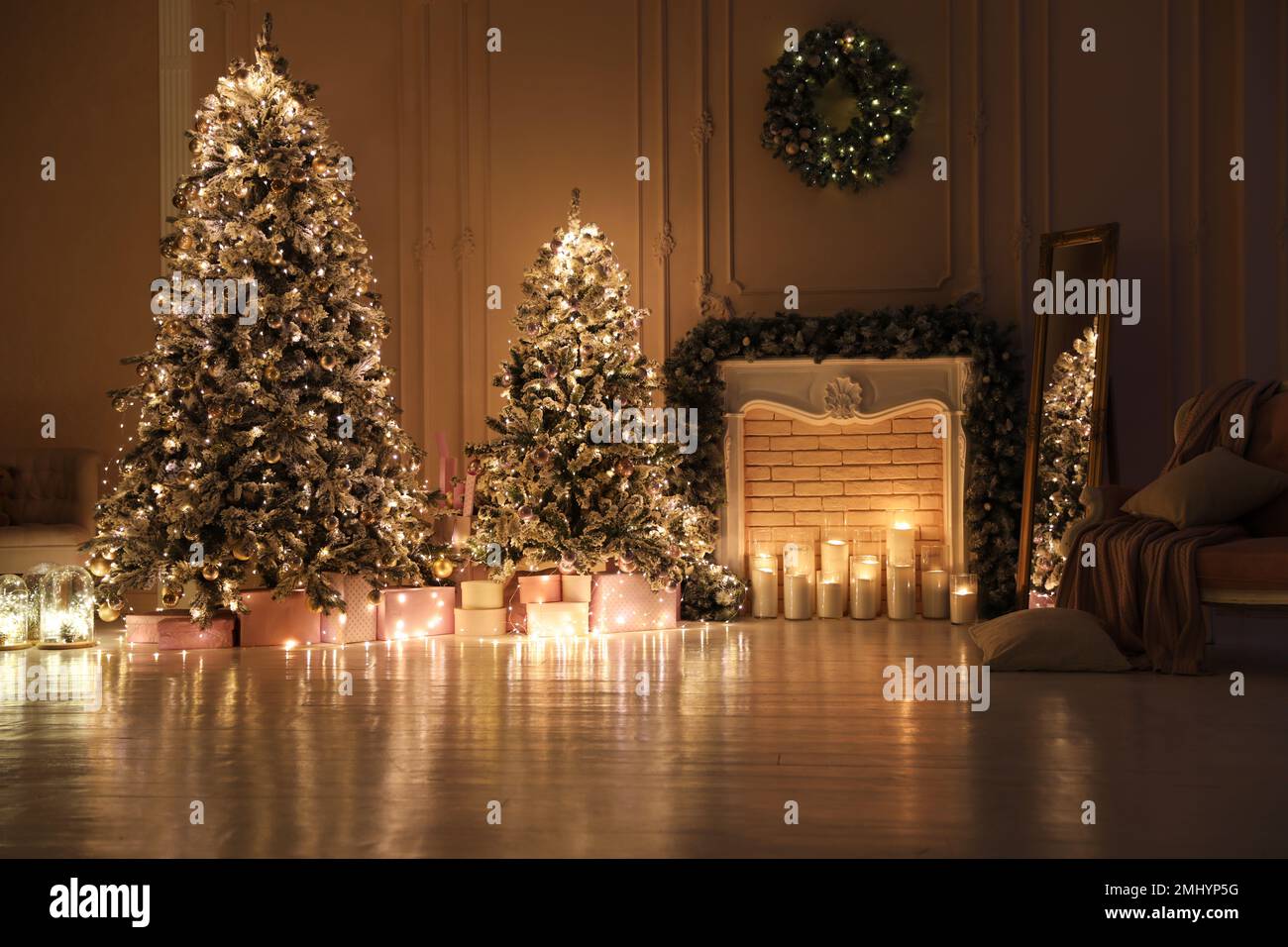 Festive room interior with beautiful Christmas trees Stock Photo - Alamy