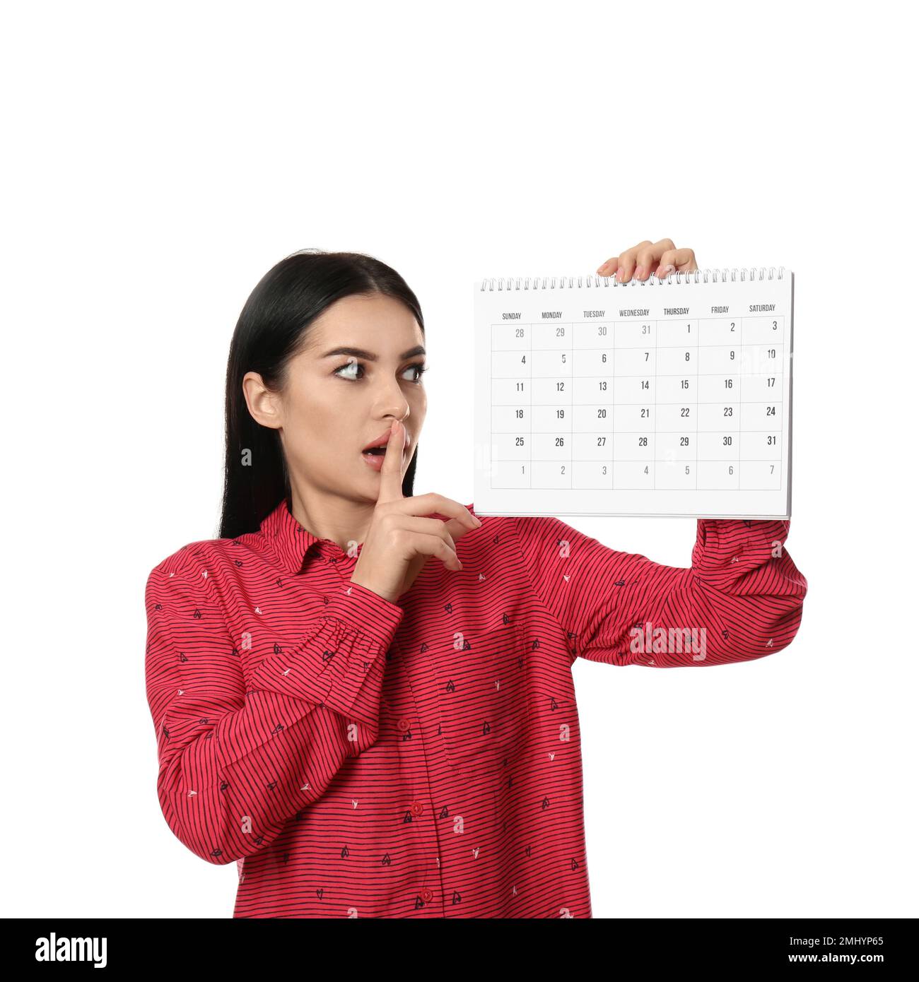 Young woman holding calendar with marked menstrual cycle days on white ...