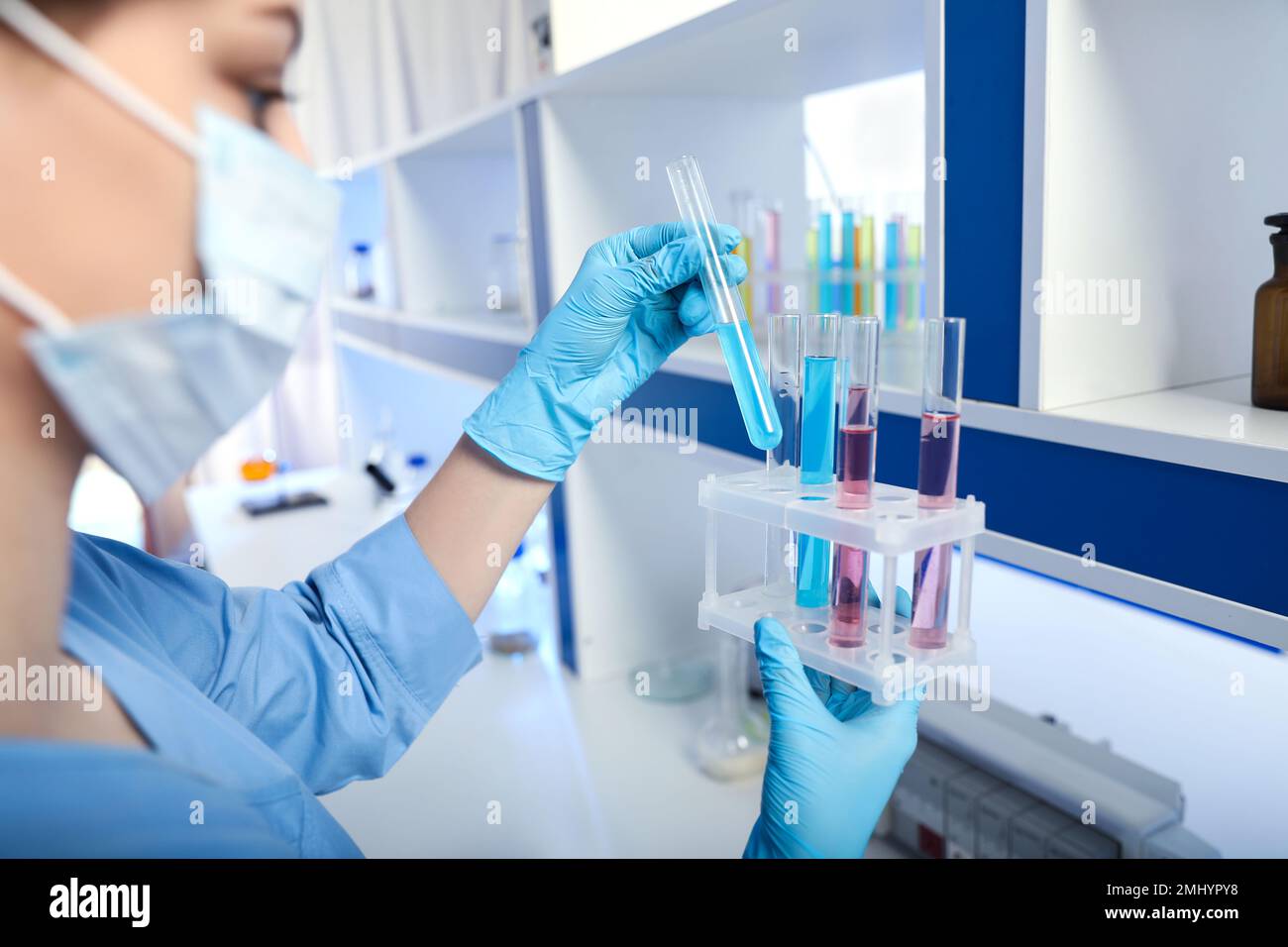 Scientist putting test tube in rack, closeup. Laboratory analysis Stock ...