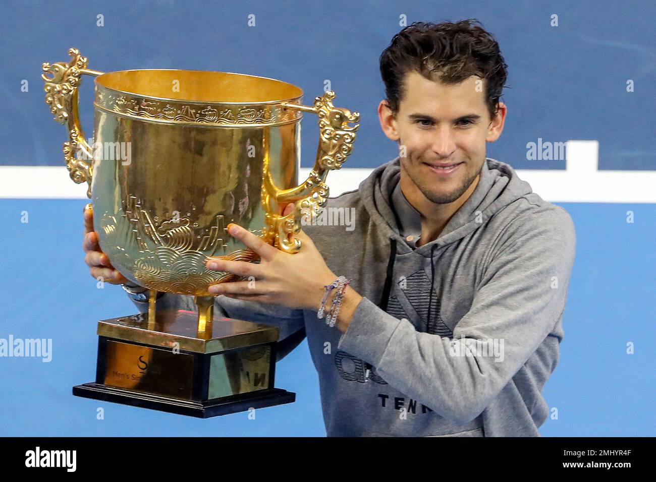 Dominic Thiem of Austria poses with his winner's trophy after defeating ...
