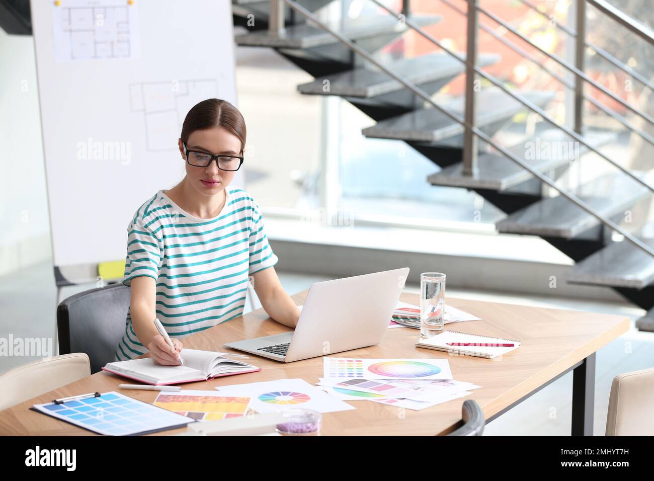 Professional interior designer at workplace in office Stock Photo - Alamy