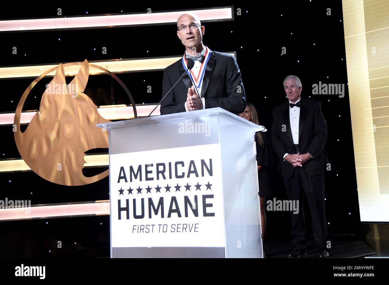 Dr. Christopher Dold accepts the national humanitarian award at the ...