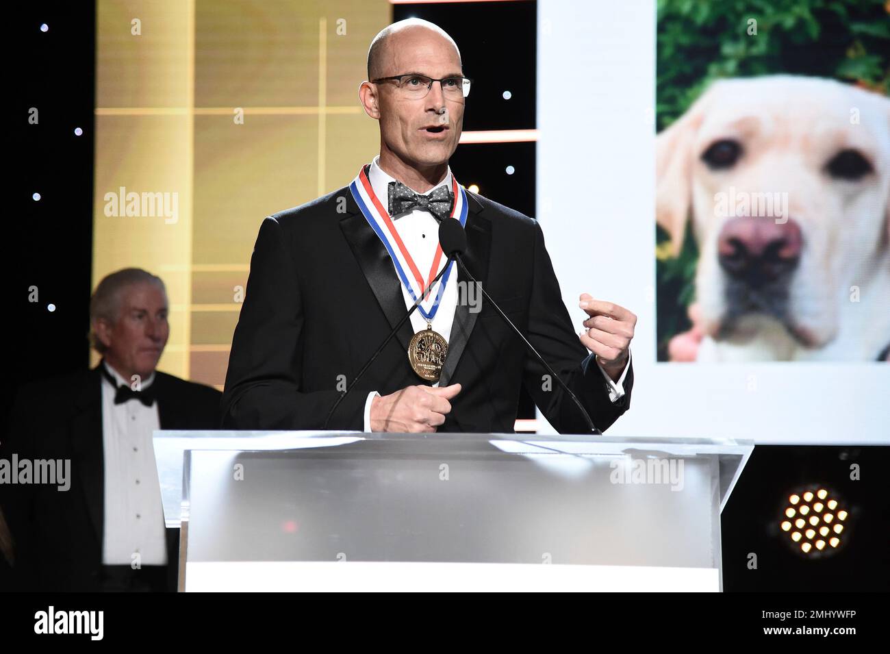 Dr. Christopher Dold accepts the national humanitarian award at the ...
