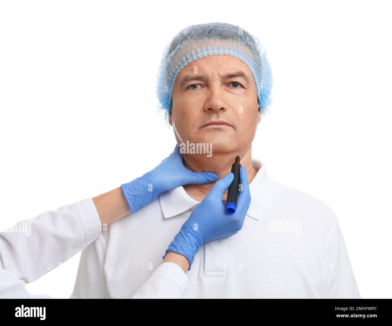Surgeon with marker preparing man for operation against white ...