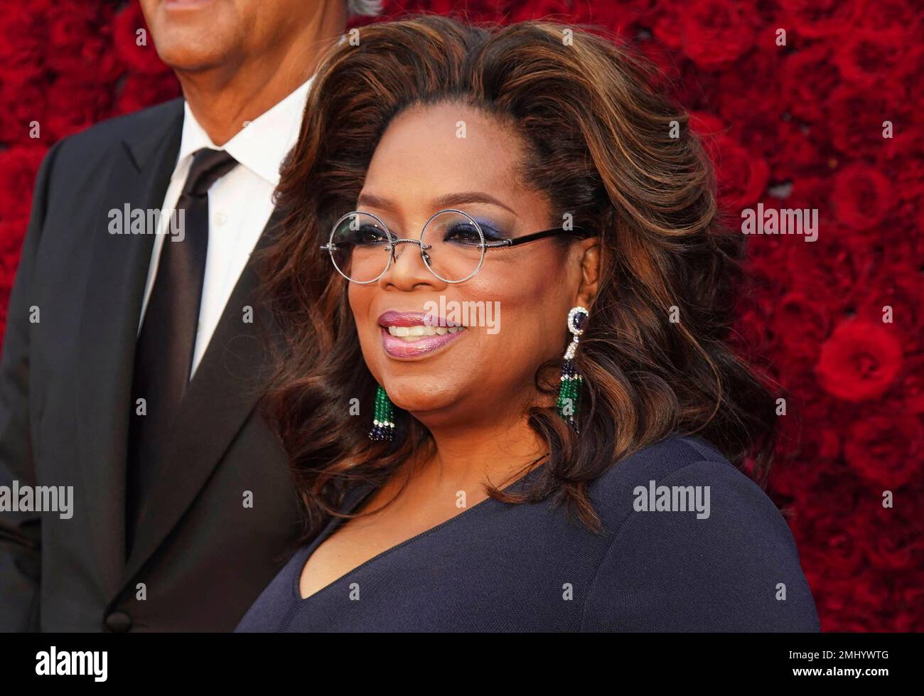 Oprah Winfrey poses for a photo on the red carpet at the grand opening ...
