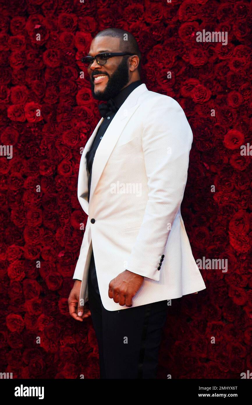 Tyler Perry poses for a photo on the red carpet at the grand opening of ...