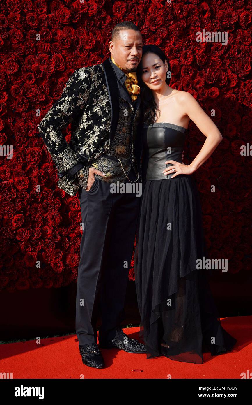 Terrence Howard and Miranda Pak pose for a photo on the red carpet at ...