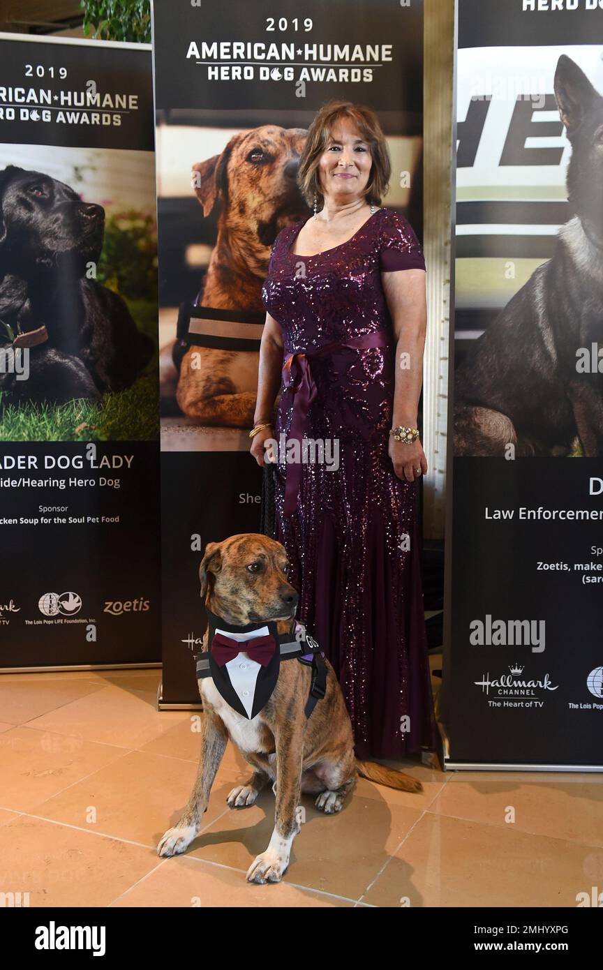 Anna Barbosa and Gus, 2019 shelter dog of the year, are seen at the ...