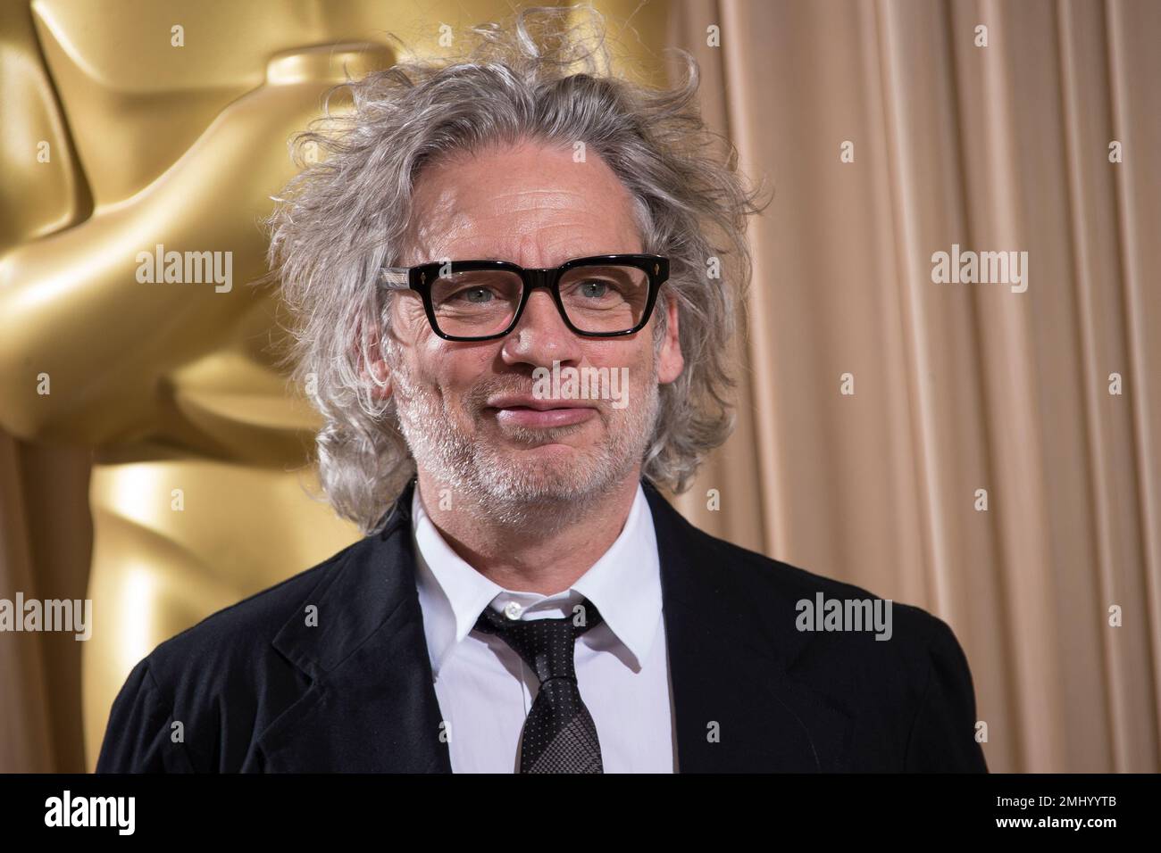 Director Dexter Fletcher poses for photographers upon arrival at the ...
