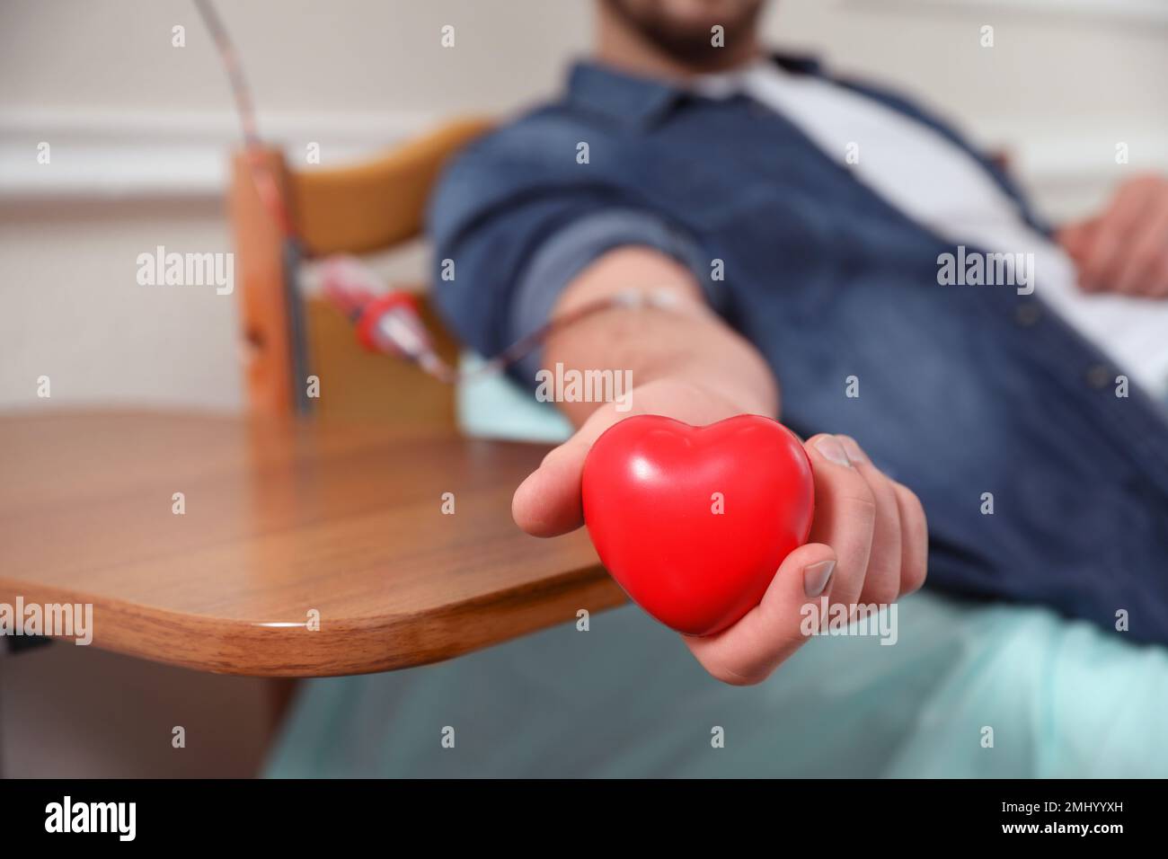 Man donating blood in hospital, closeup view Stock Photo - Alamy