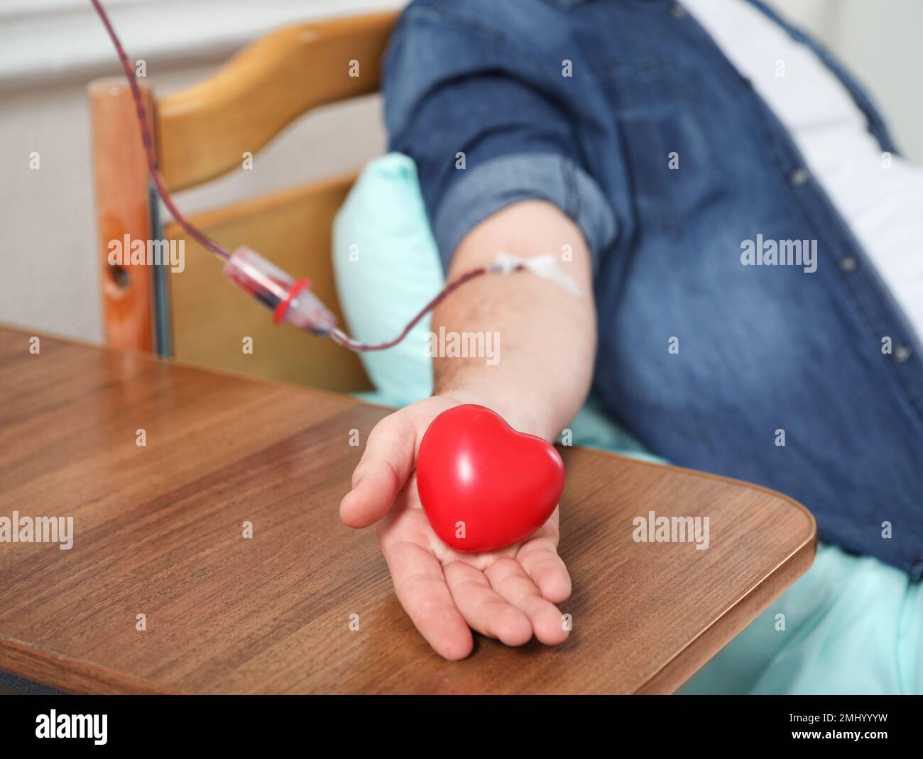 Man donating blood in hospital, closeup view Stock Photo - Alamy