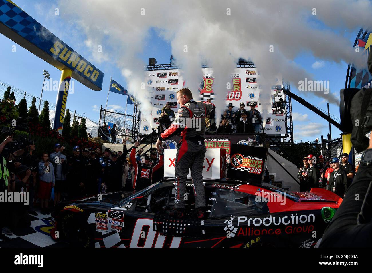 Driver Cole Custer car (#00) celebrates on top of his car in the ...