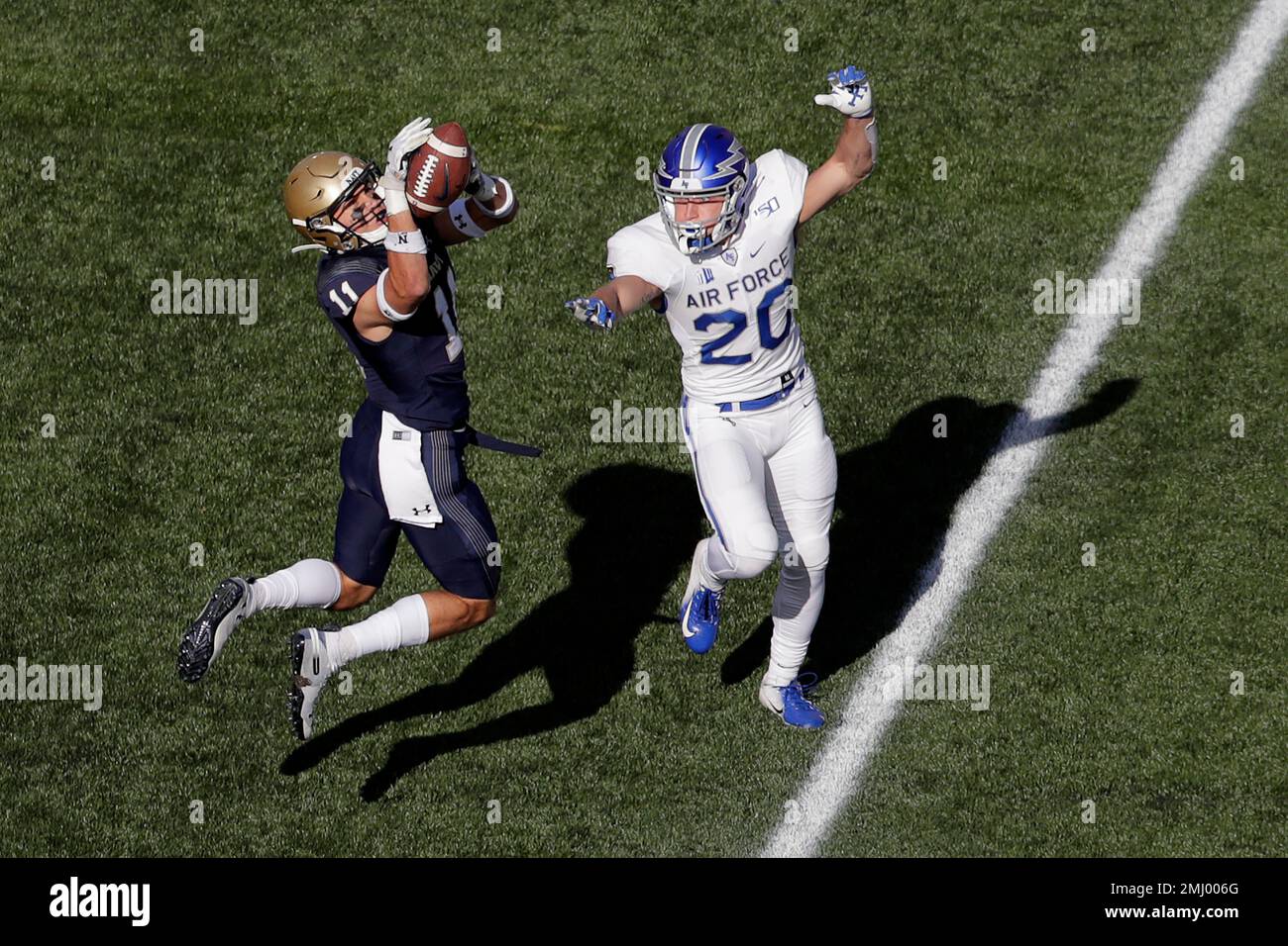 Navy safety Evan Fochtman, left, intercepts a pass intended for Air ...