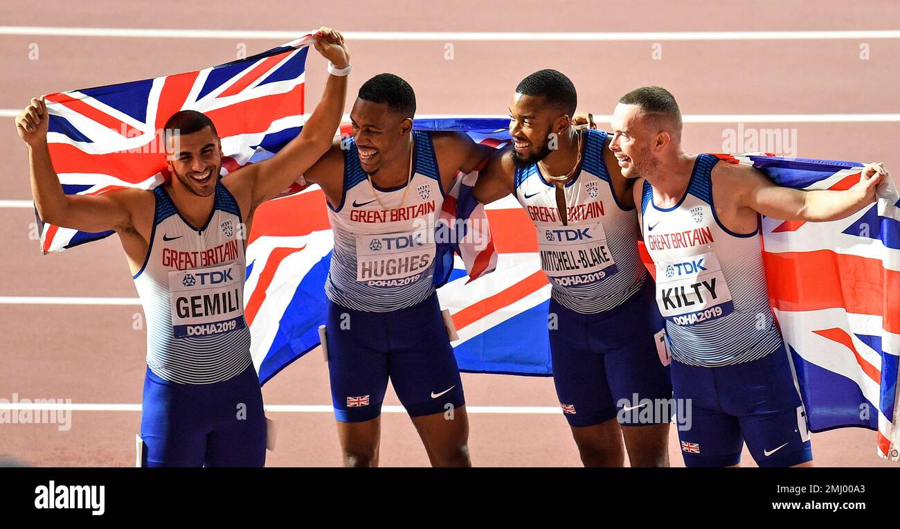 Britain's team poses with flags after winning the silver medal in the ...