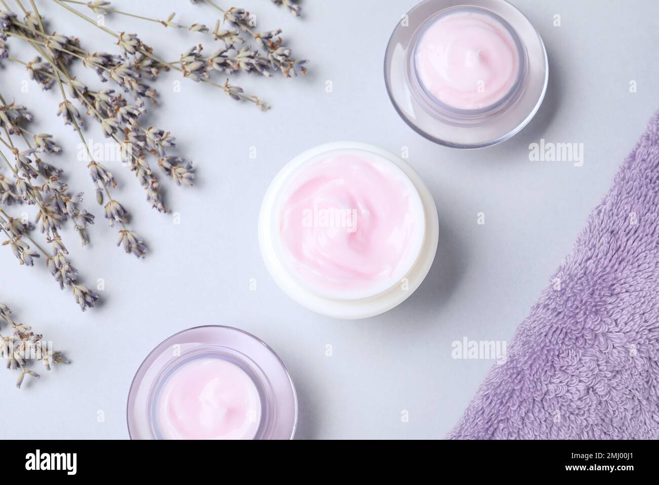 Flat lay composition with jars of cream on white background Stock Photo ...