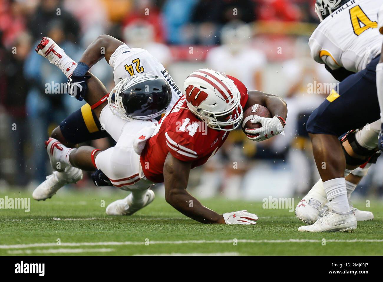 Wisconsin running back Nakia Watson (14) and Kent State defensive back ...